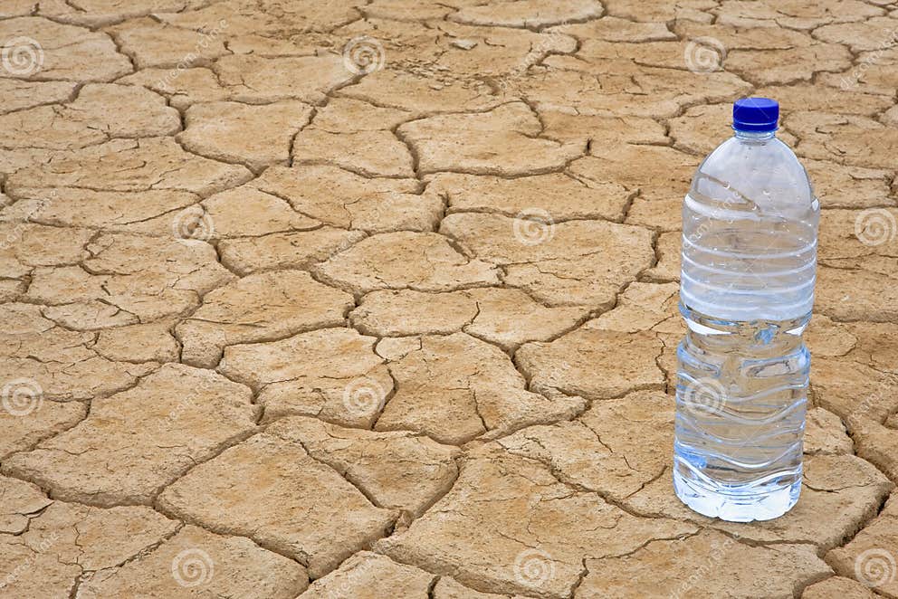 Water bottle on dry ground stock image. Image of global - 11228939