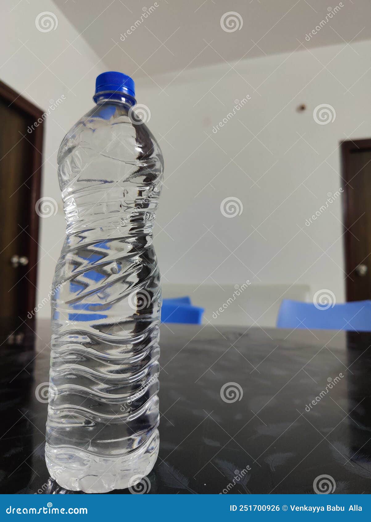 Water bottle on a table stock photo. Image of table - 251700926