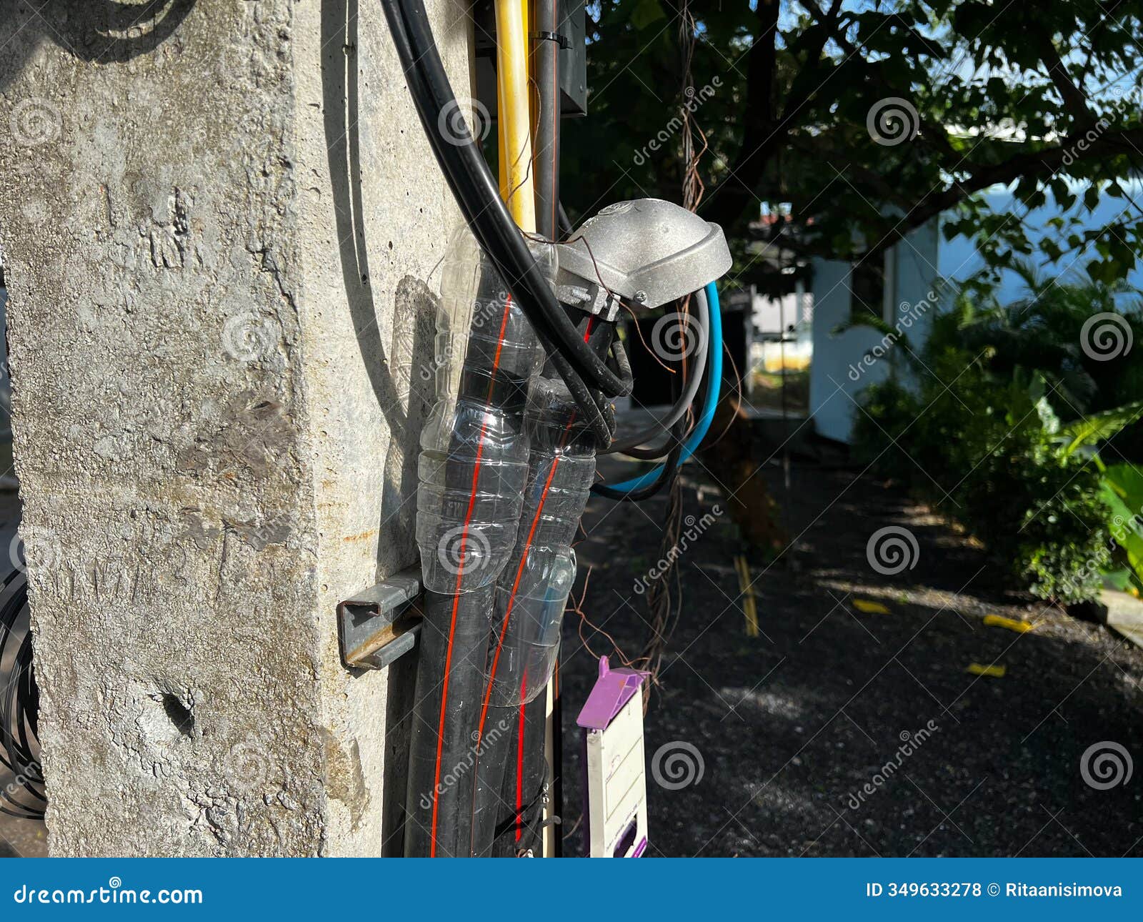 Water Bottles Used As Makeshift Electrical Wire Protection on a Utility ...