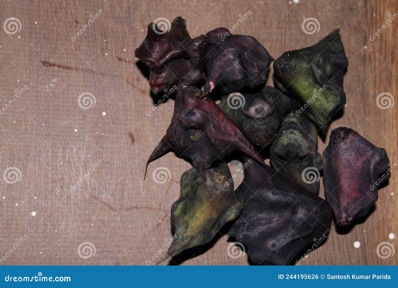 Water Caltrop Fruit on the Wooden Background Stock Photo - Image of ...
