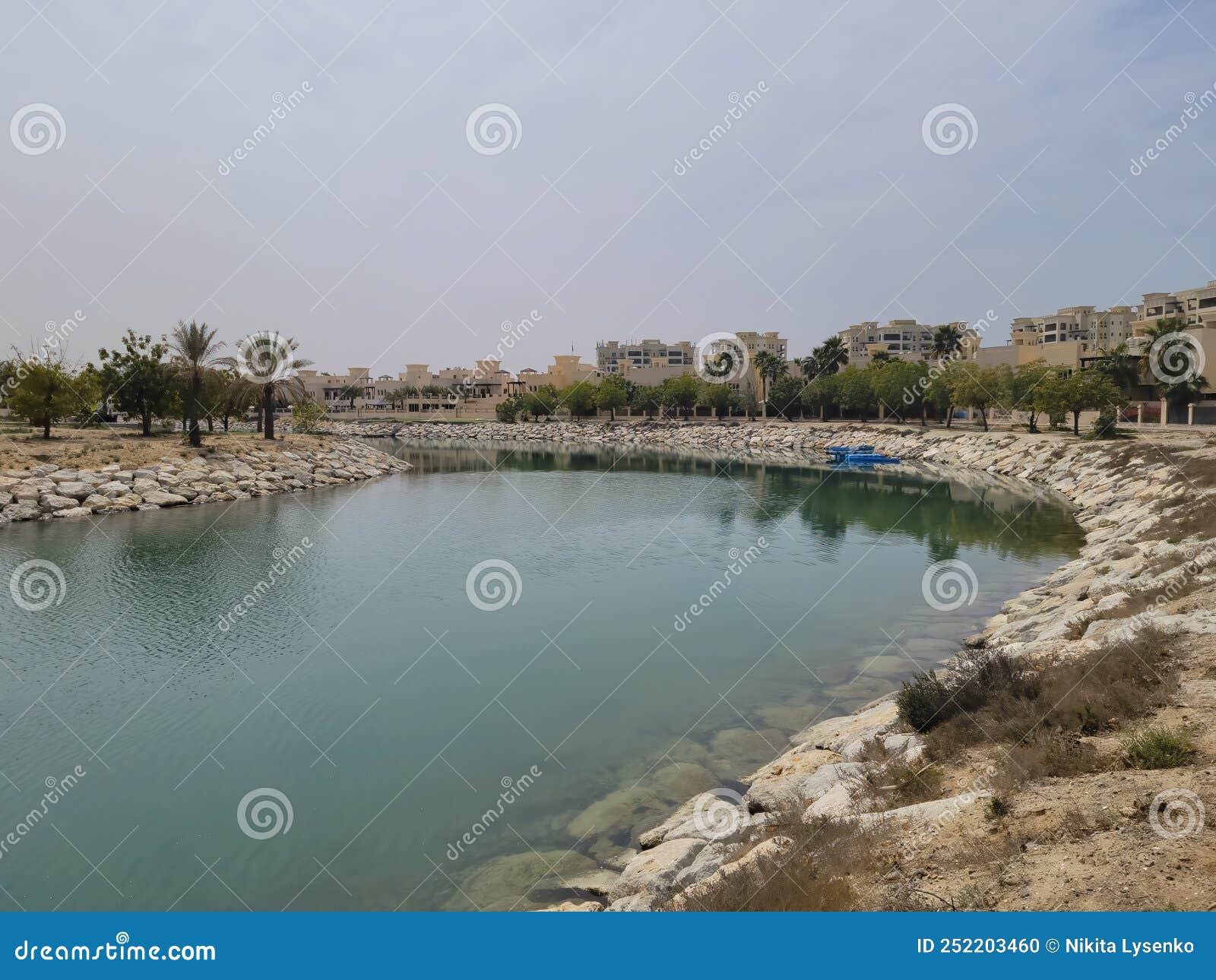 Water Channel with Emerald Water Extending Under the Bridge Stock Photo ...