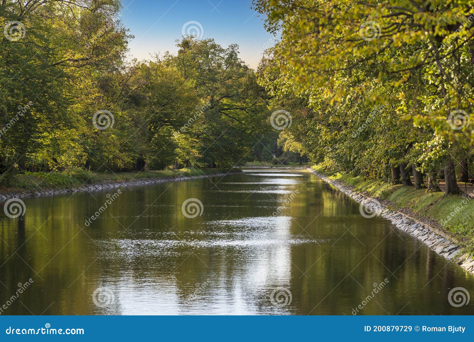 Water Channel Lined with Trees. in the Background is a Blue Sky Stock ...