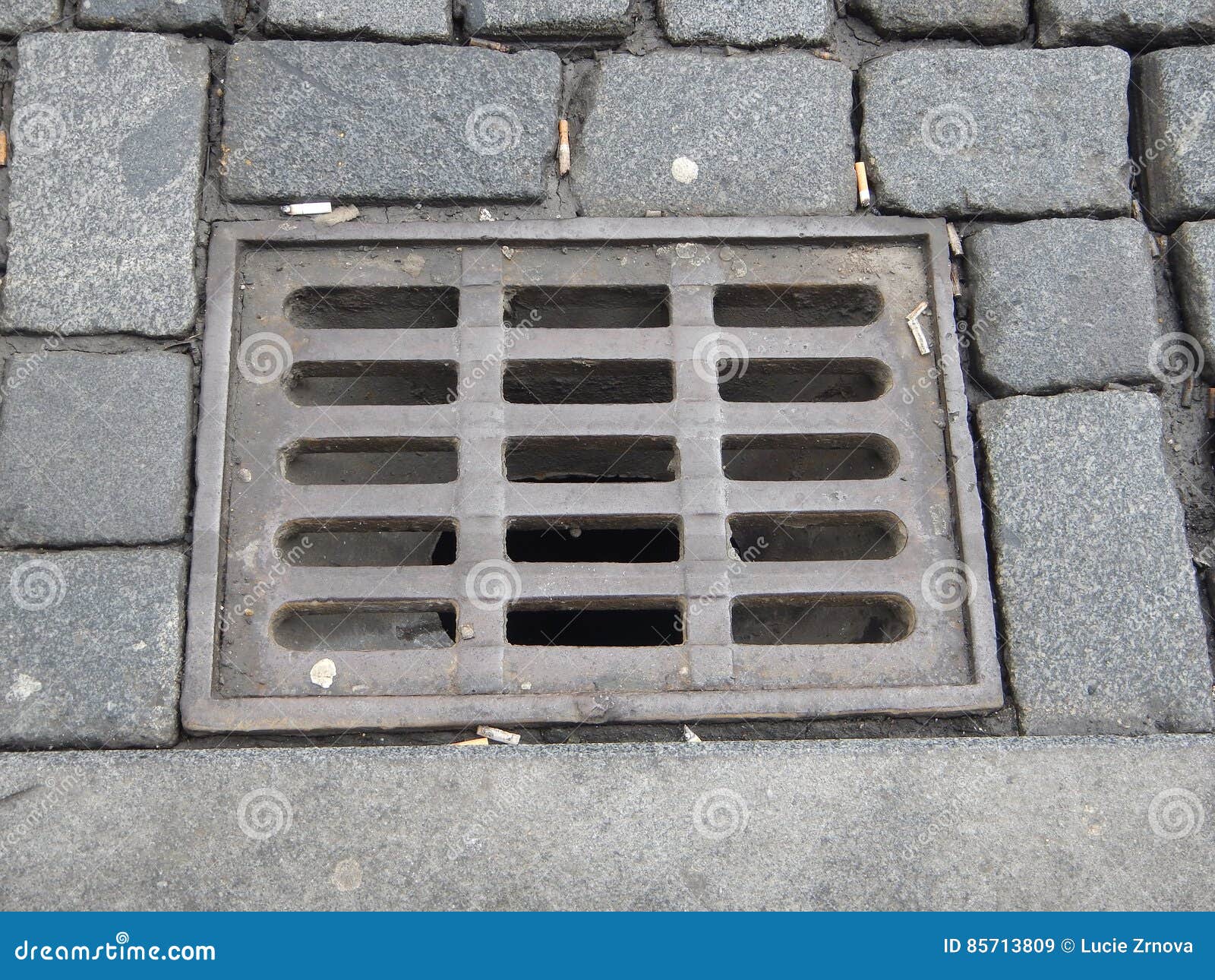 Water Drainage Hole with Grid on a Cobbled Street Stock Image - Image ...