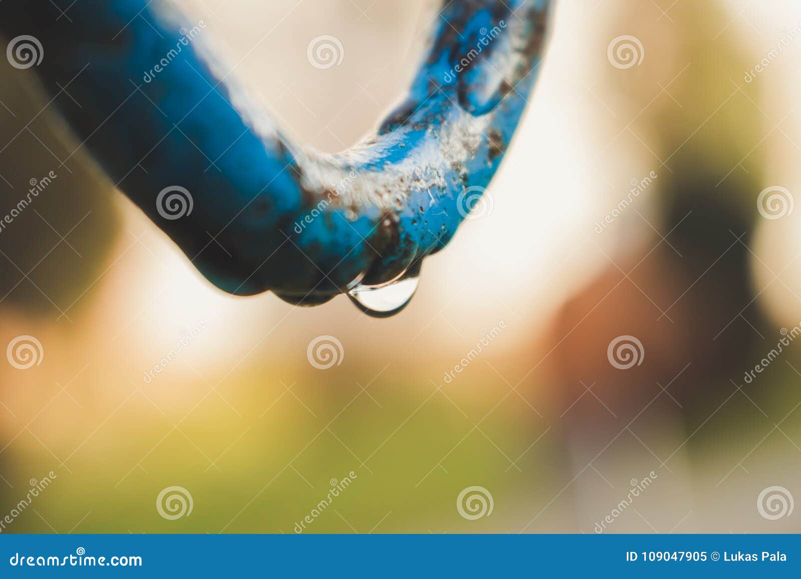Water Drip on Blue Metal Rail. Stock Image - Image of water, drip ...
