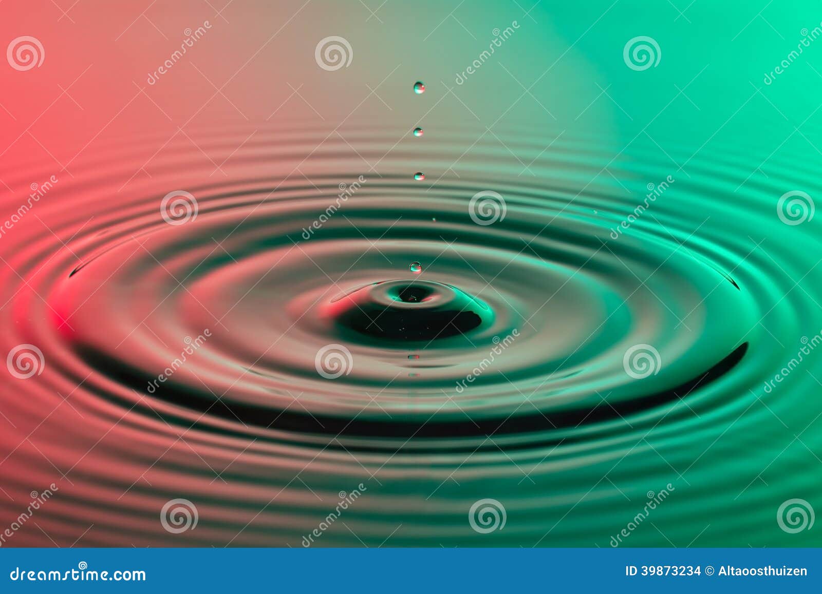 Water Drop Close Up with Concentric Ripples Colourful Red and Gr Stock ...