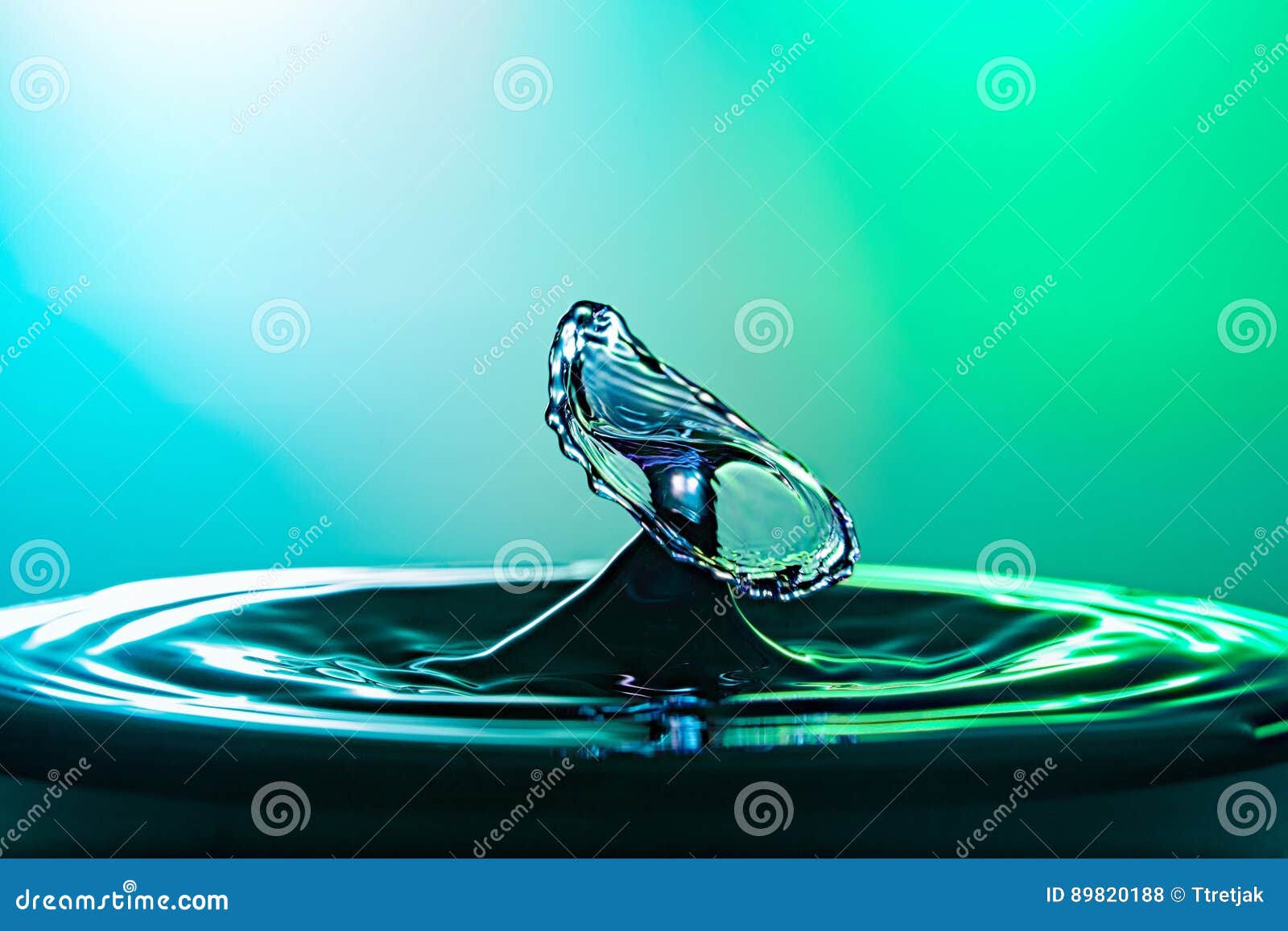 Water Drop Collision Close Up Image with a Green and Blue Background ...