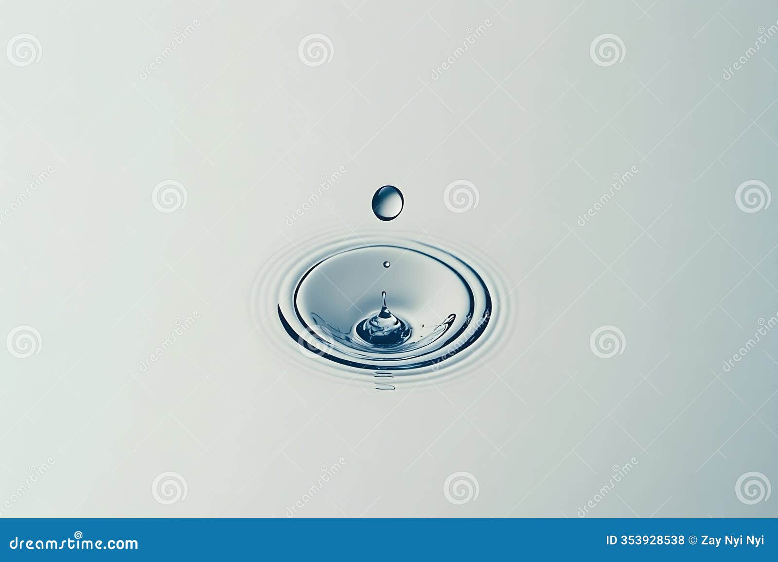 Water Drop Disturbs the Surface of Still Water, Causing Splash and ...