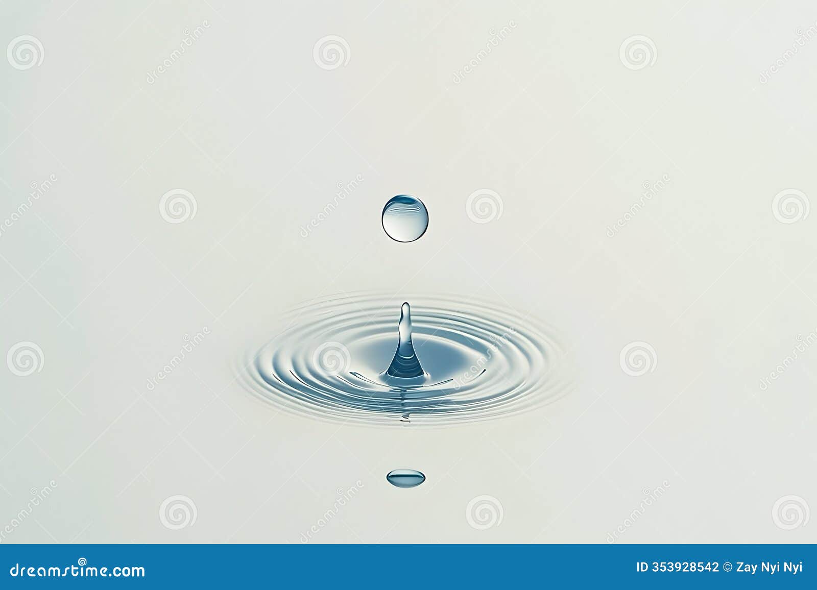 Water Drop Disturbs the Surface of Still Water, Causing Splash and ...