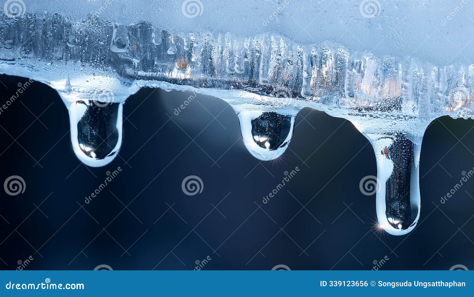 A Water Drop Falling in Slow Motion from the Tip of an Icicle ...