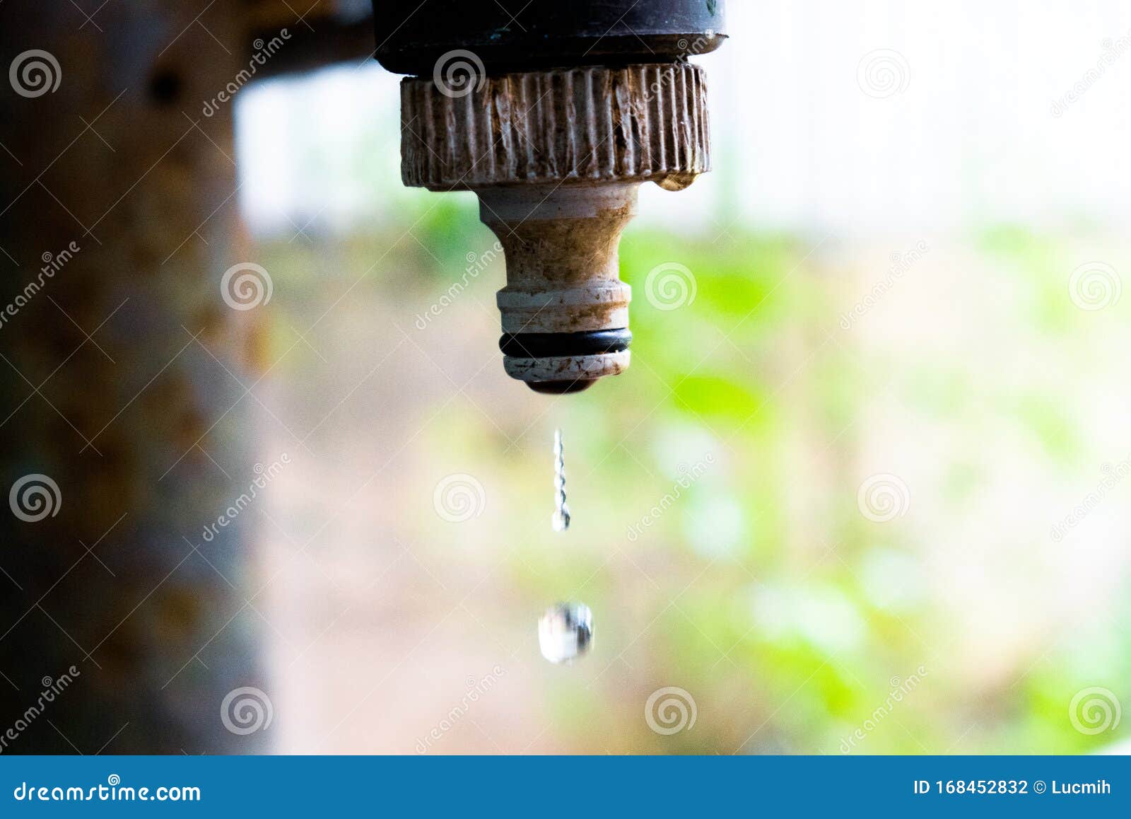 A Water Drop Falls from a Dirty and Rusty Water Tap - Water Engineering ...