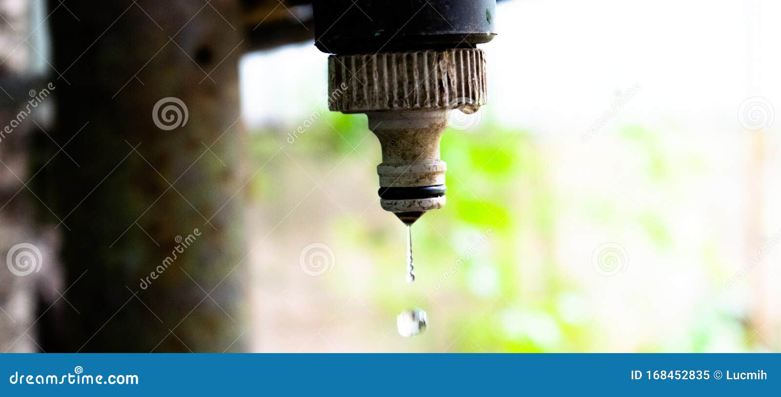 A Water Drop Falls from a Dirty and Rusty Water Tap - Water Engineering ...