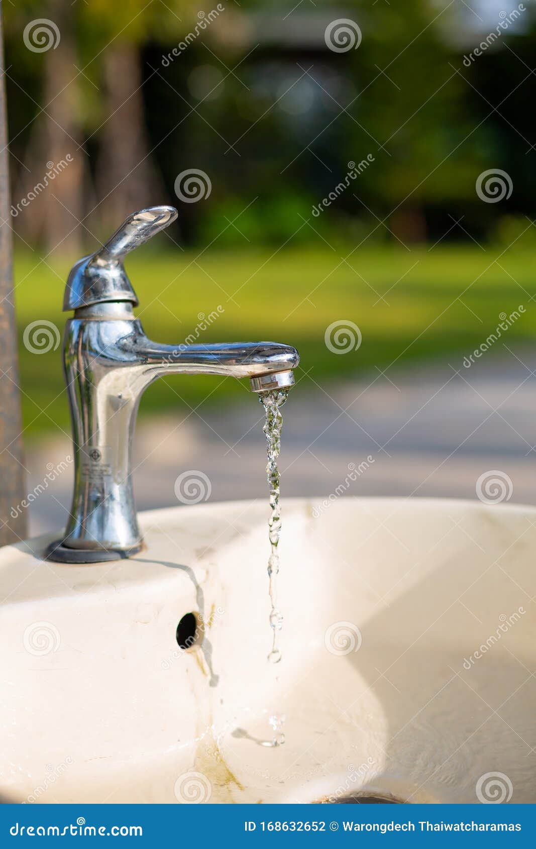 Water drop from faucet stock photo. Image of basin, blue - 168632652
