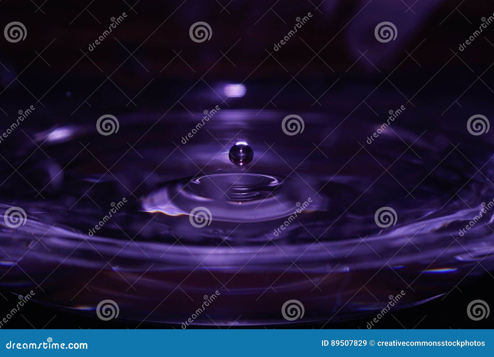 Water Drop In Purple Liquid Picture. Image: 89507829
