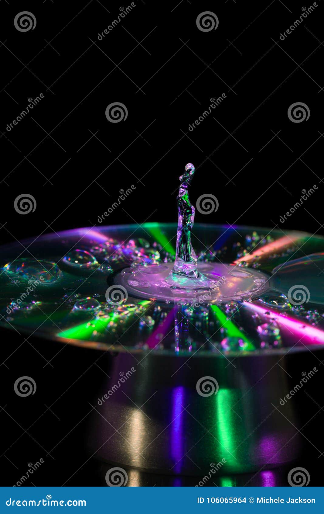Water Drop on a CD with Colored Lights Stock Photo - Image of freeze ...
