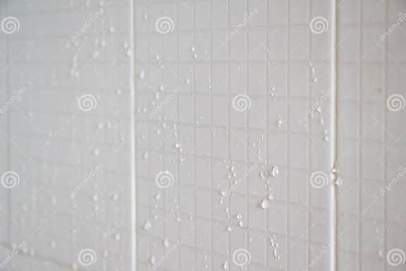 Water drop on tile wall stock image. Image of clear - 145183003