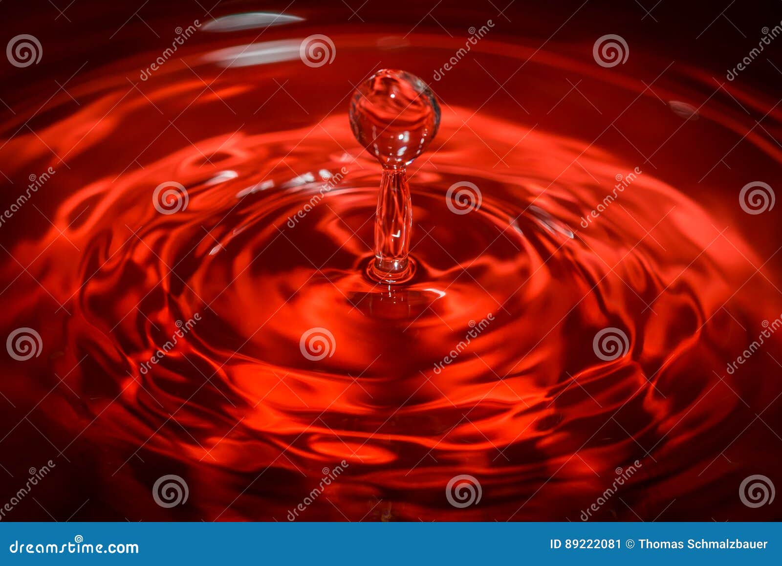 Water Drop an Waves with Red Background and Reflection Stock Image ...