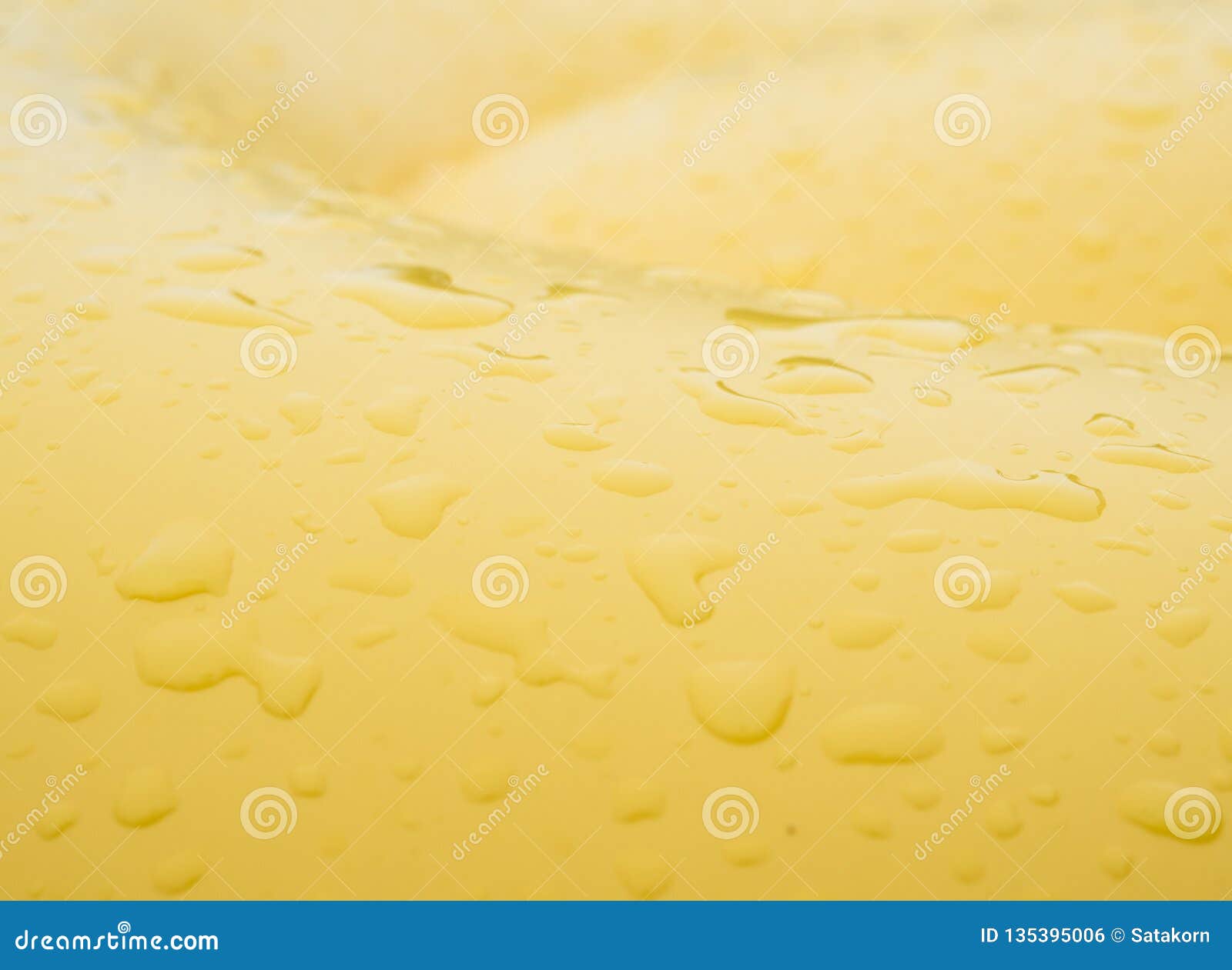 Water Droplet on Surface of Vivid Yellow Pool Float Stock Photo - Image ...