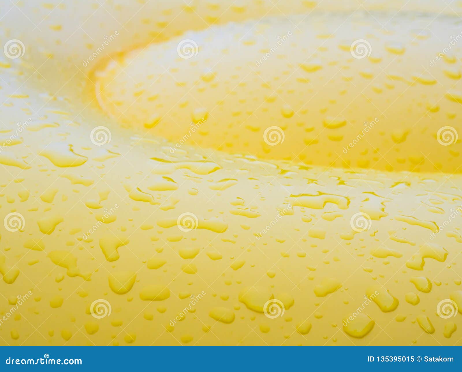Water Droplet on Surface of Vivid Yellow Pool Float Stock Image - Image ...
