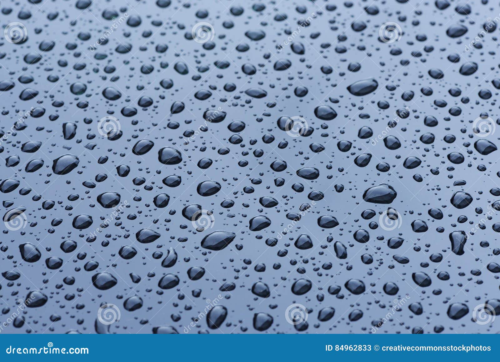 Water Droplets On Blue Surface Picture. Image: 84962833
