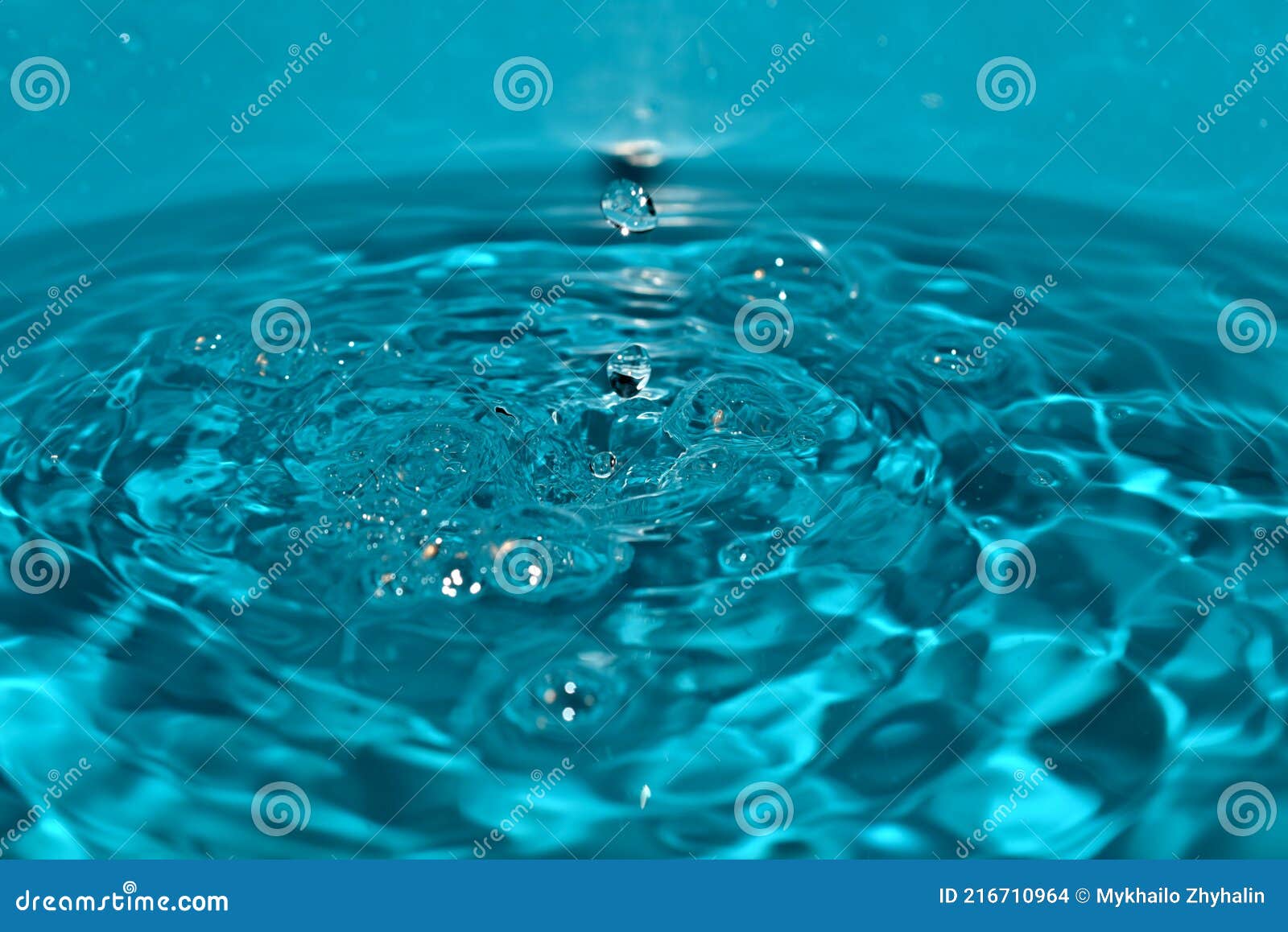 Water Droplets Fall Continuously Onto the Surface of the Liquid. Stock ...