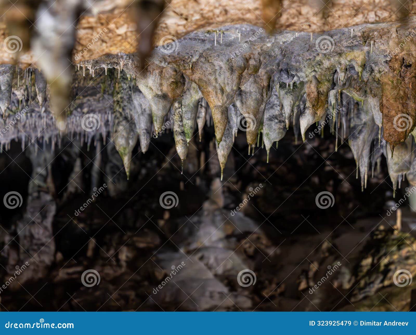 Water Droplets Falling from Stalactites in Cave Stock Image - Image of ...