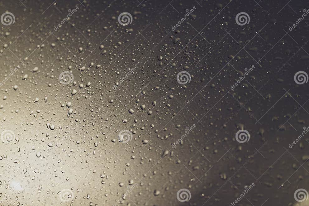 Water Droplets Forming on a Waterproof Surface with Light Reflecting ...