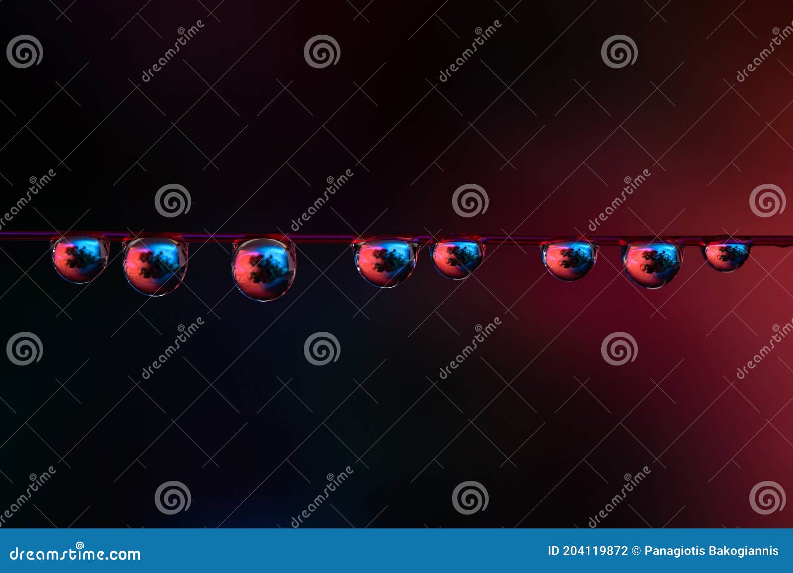 Water droplets on red wire stock photo. Image of front - 204119872