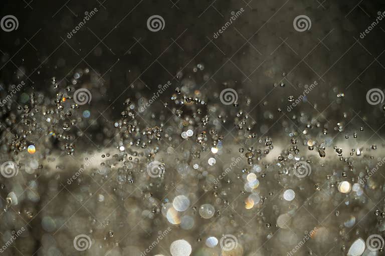 Water Droplets Sparkle in the Light with Captivating Reflections at ...
