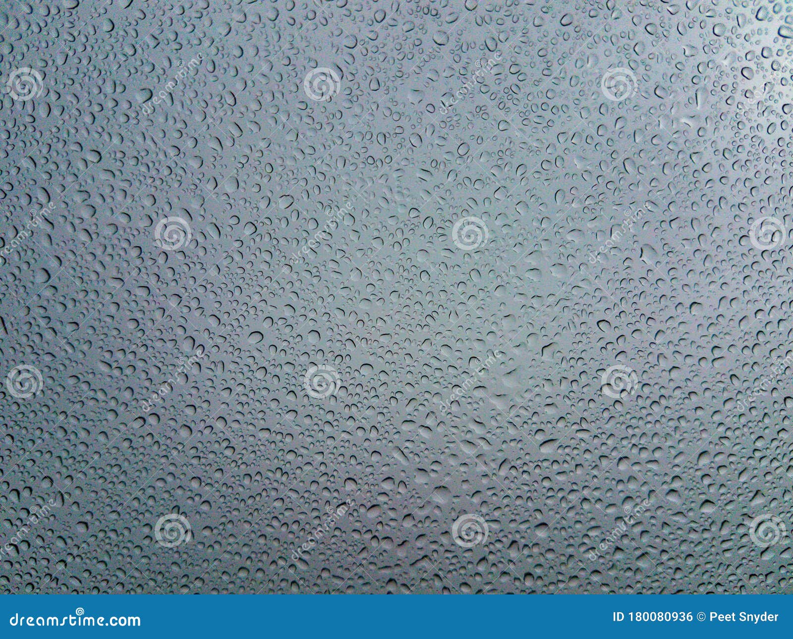 Water droplets on a window stock photo. Image of circle - 180080936