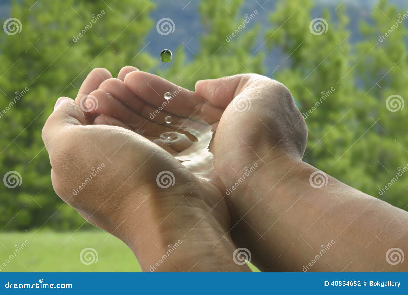 Water dropping on hand stock photo. Image of hand, raindrop - 40854652