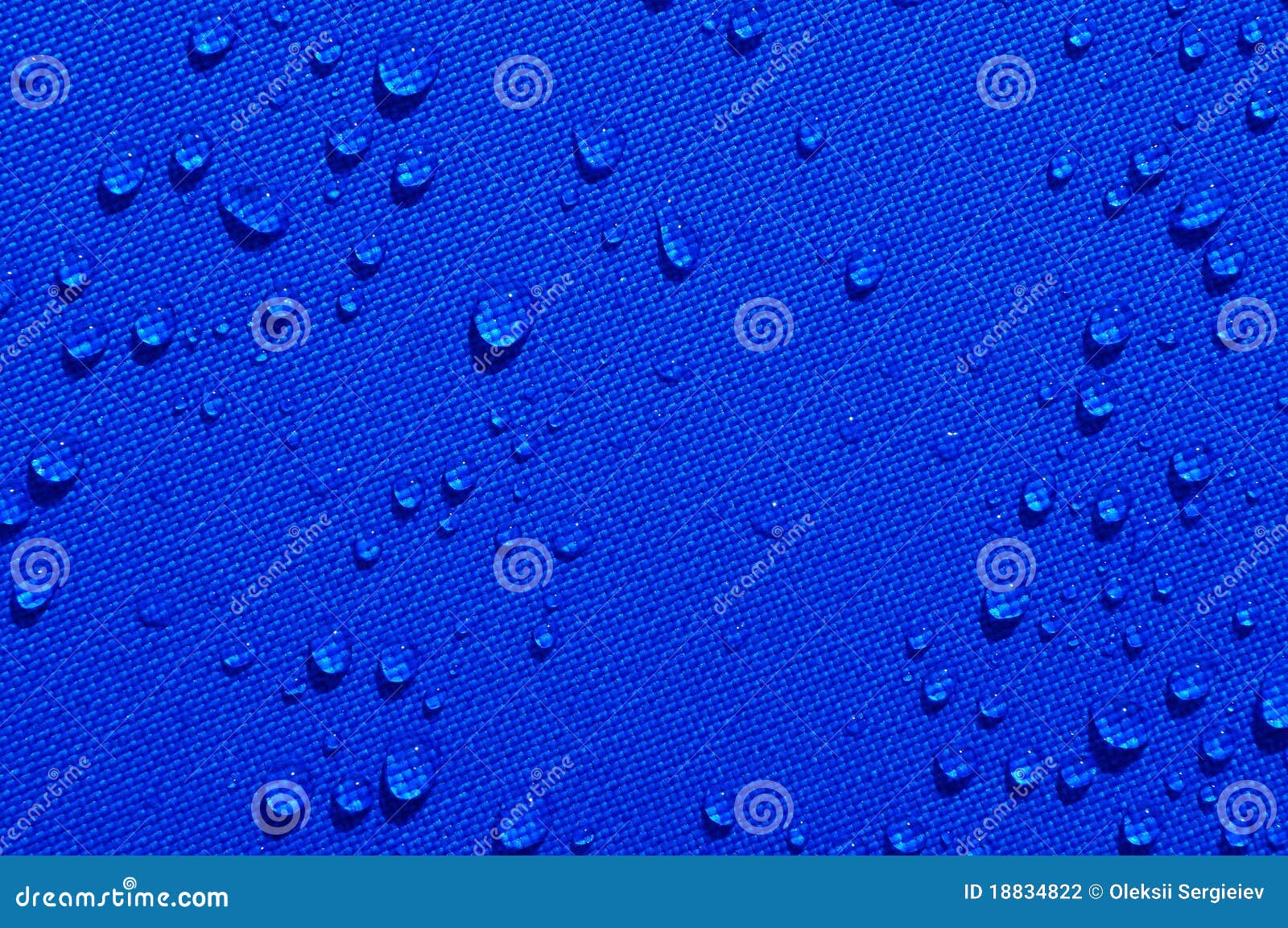 Water drops on blue fabric stock photo. Image of shower - 18834822