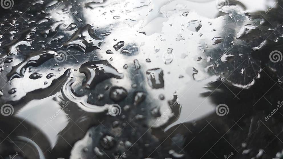 Water Drops Blur Abstract Background on Black Ceramic Tile Stock Photo ...