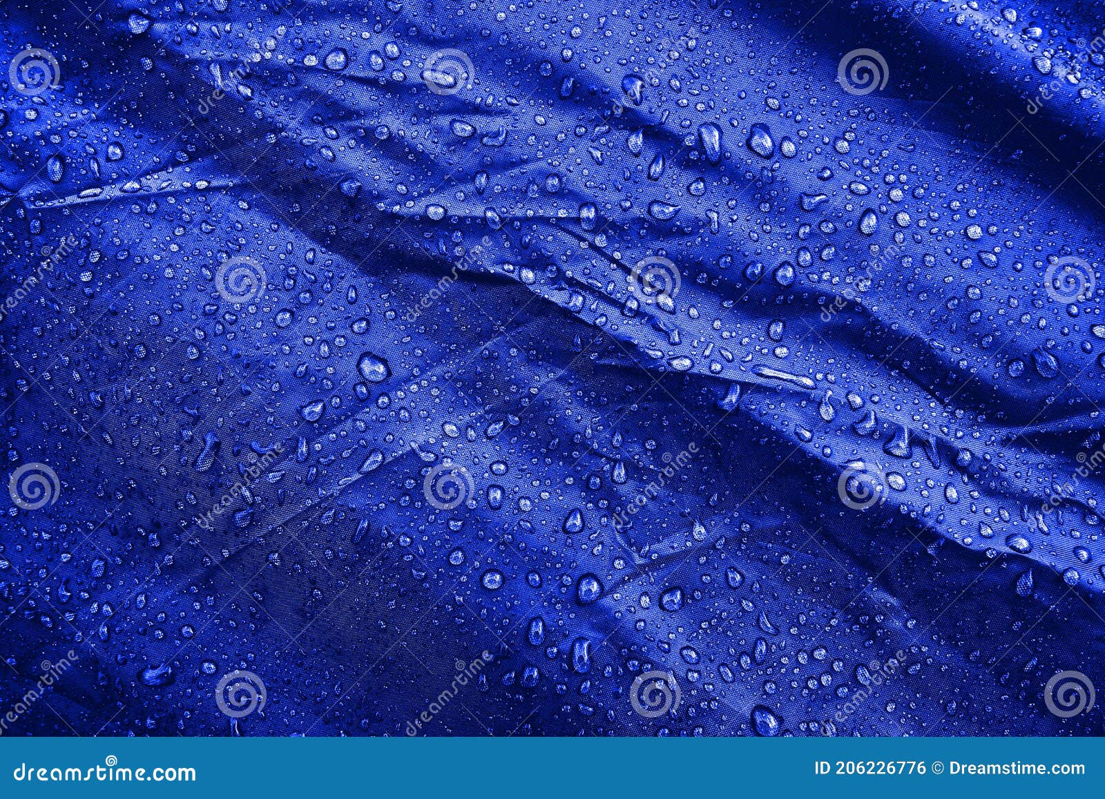 Water drops on the fabric. stock photo. Image of beads - 206226776