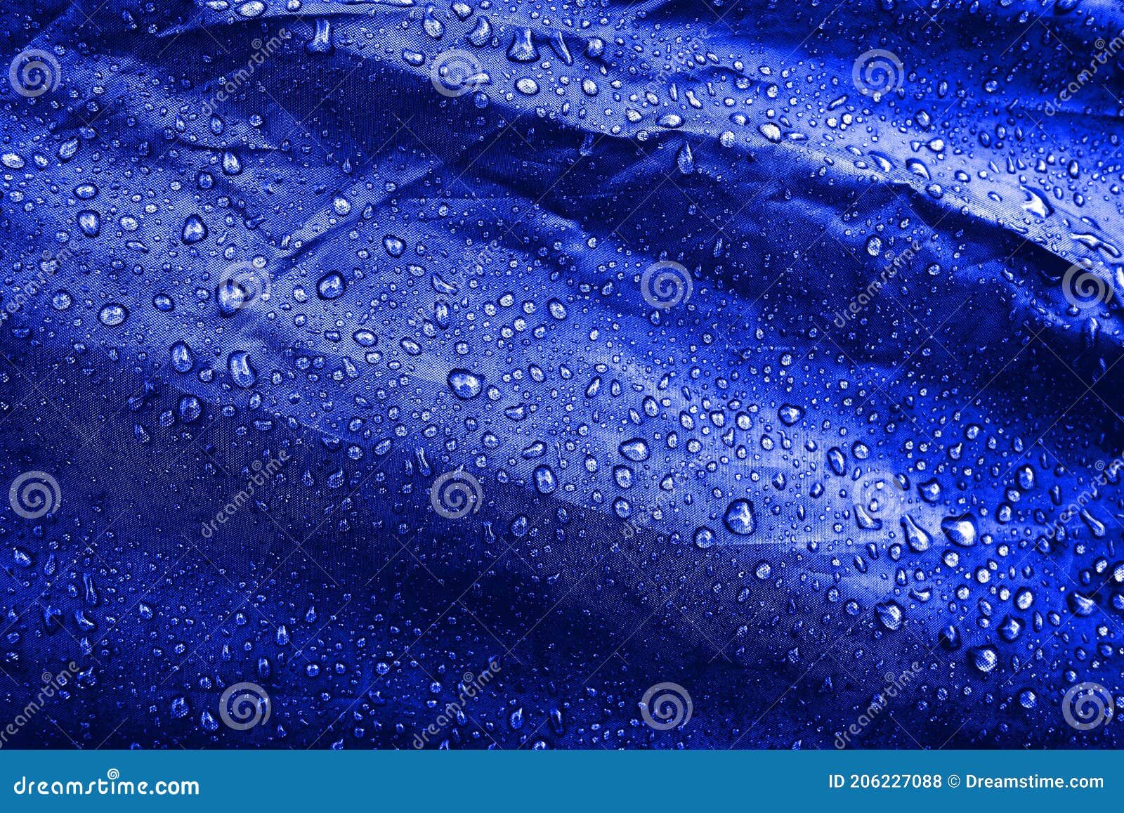 Water drops on the fabric. stock photo. Image of macro - 206227088