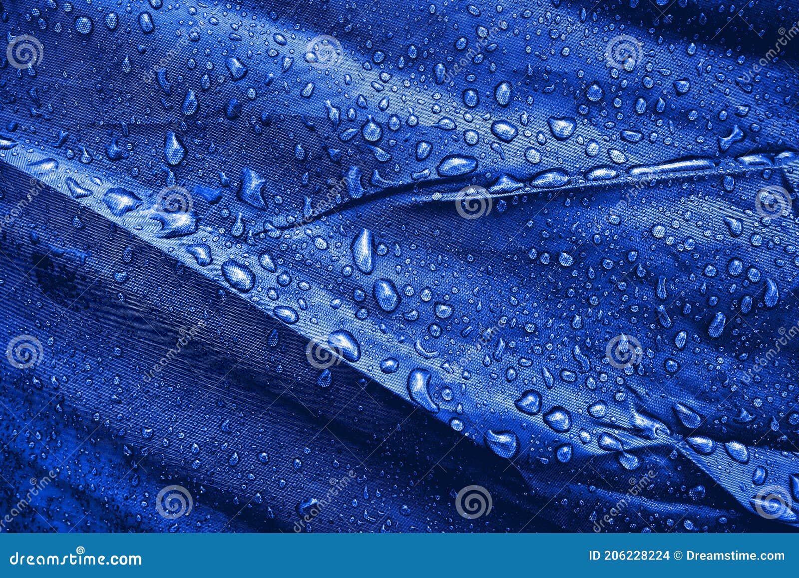 Water drops on the fabric. stock photo. Image of environment - 206228224