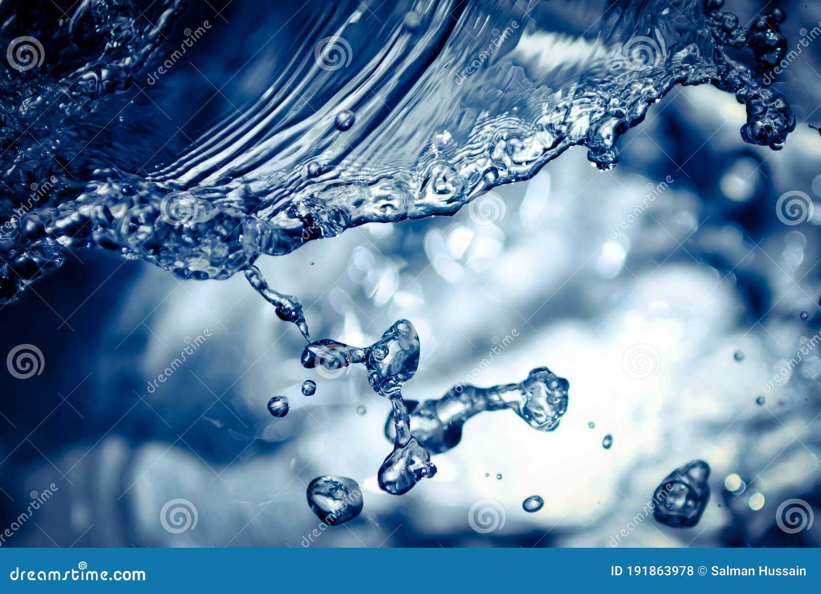 Water Drops Flowing in Blue Stock Photo - Image of falling, midair ...