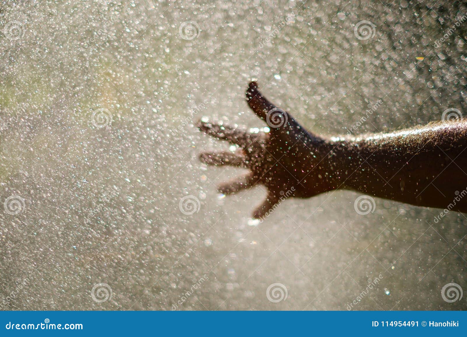 Water Drops and Hand - Holding Hand in Water Splash - Stock Image ...