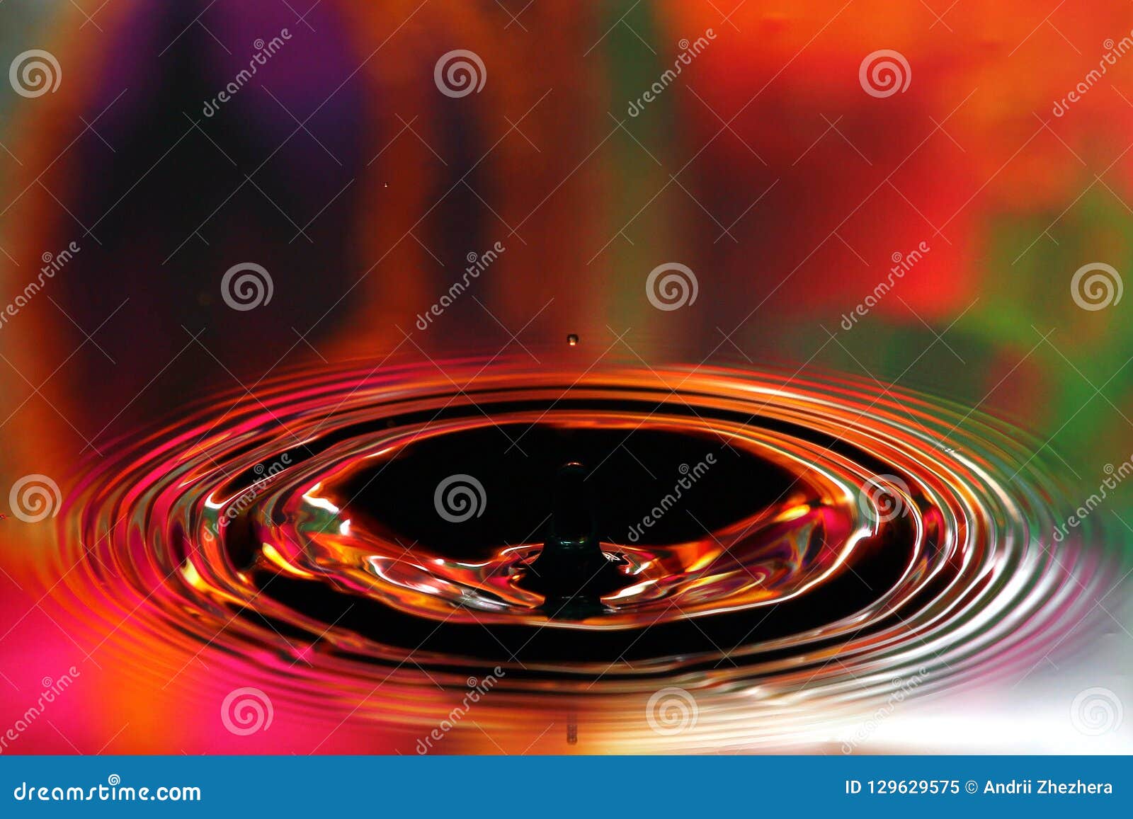 Water Drops Splash. Red and Yellow Ripples, Reflections on Surface ...