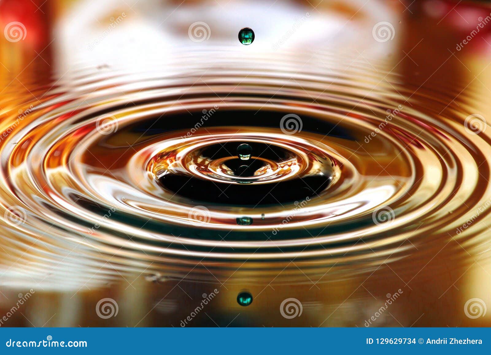 Water Drops Splash. Ripples and Reflections on Surface Stock Photo ...