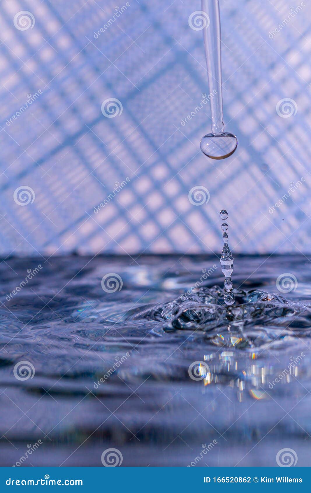 Water Drops Splashing in Front of a Blue Striped Background with ...