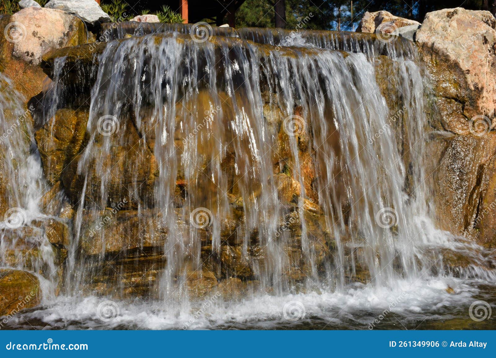 Close Up of a Water Fall Falling into a Pond Below Creating a Lot of ...