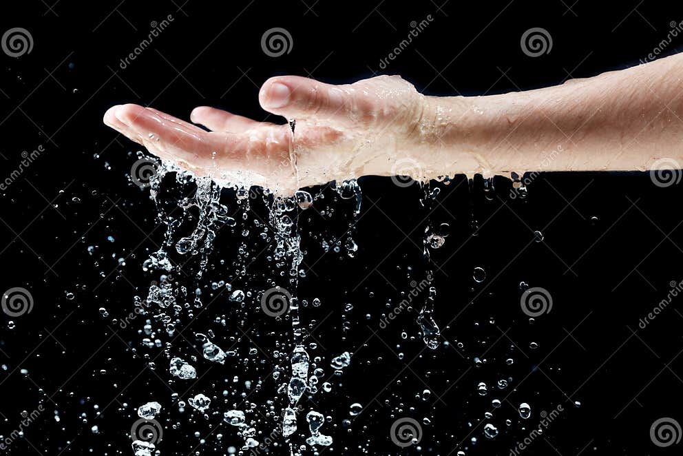 Water falling on hand stock image. Image of catching - 24249943