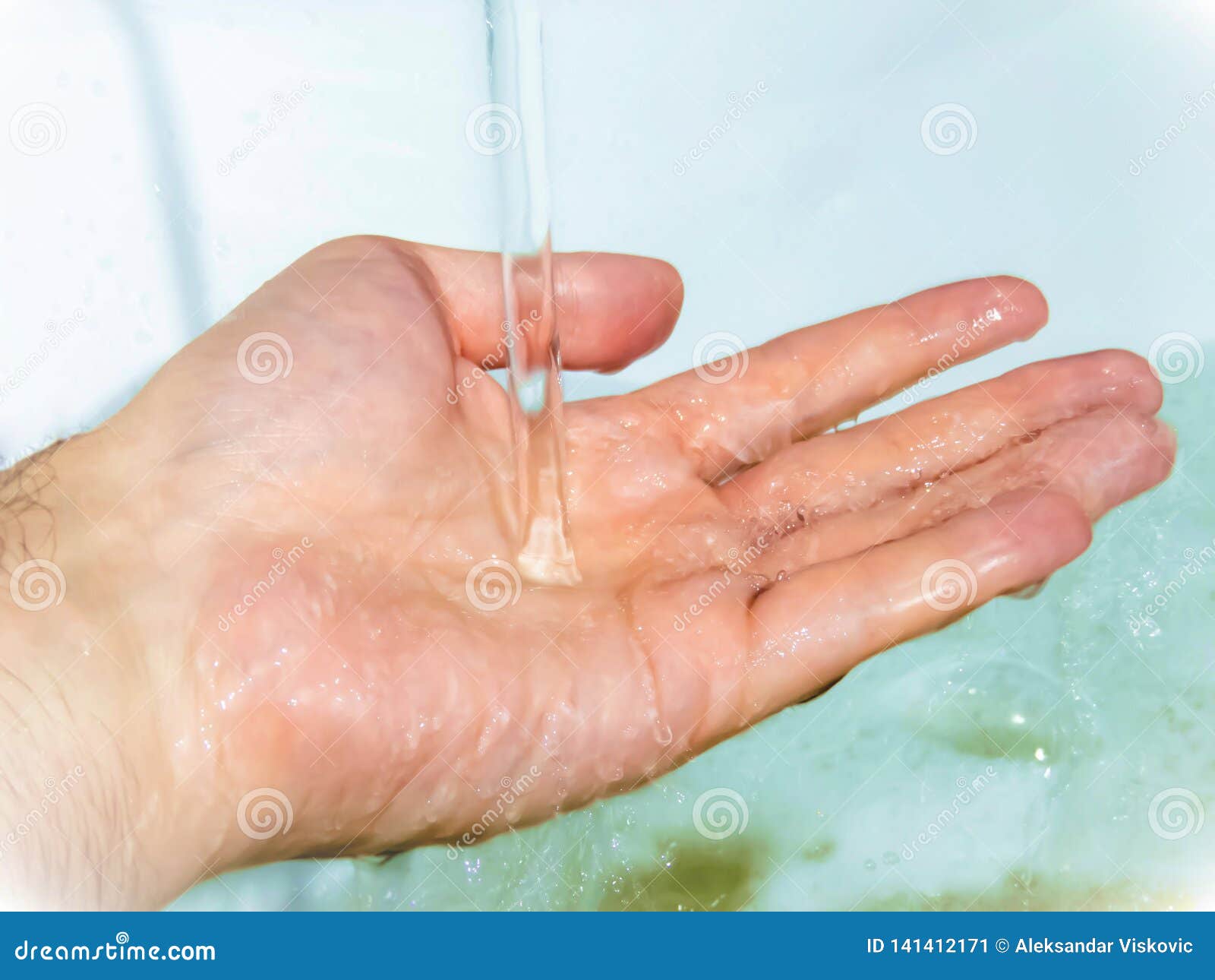 Water falling into hand stock image. Image of relax - 141412171