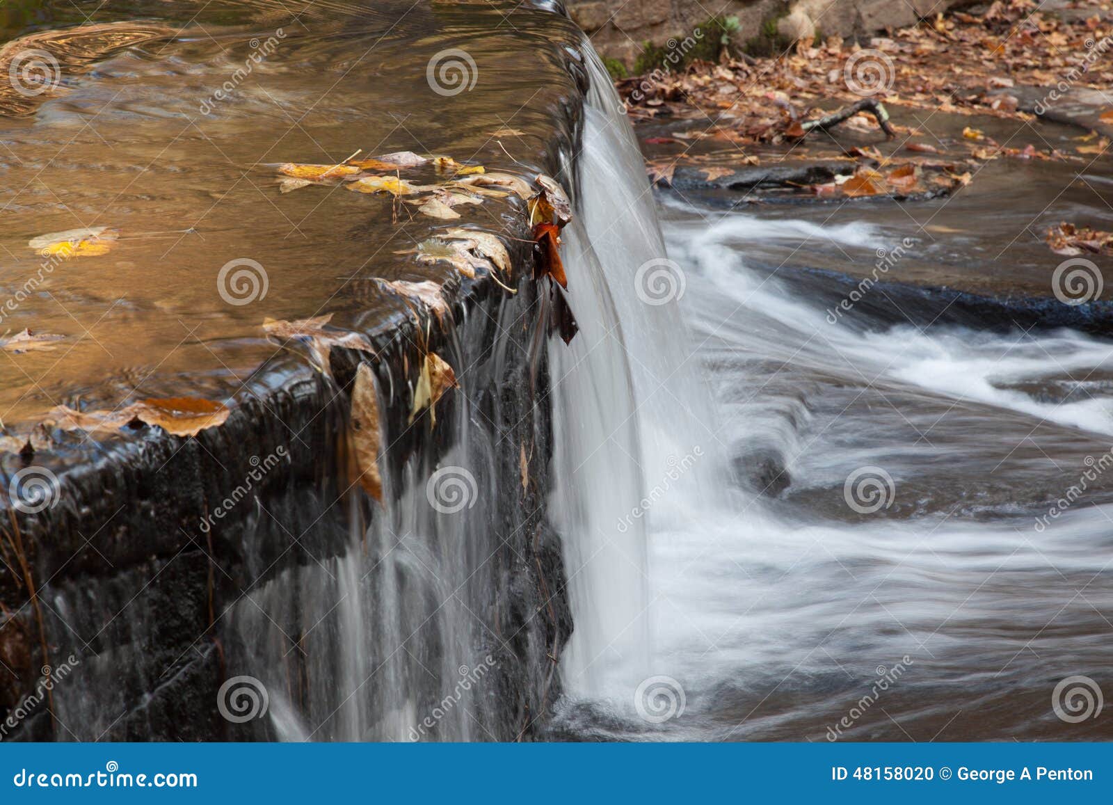Water falling over a dam stock photo. Image of refreshing - 48158020
