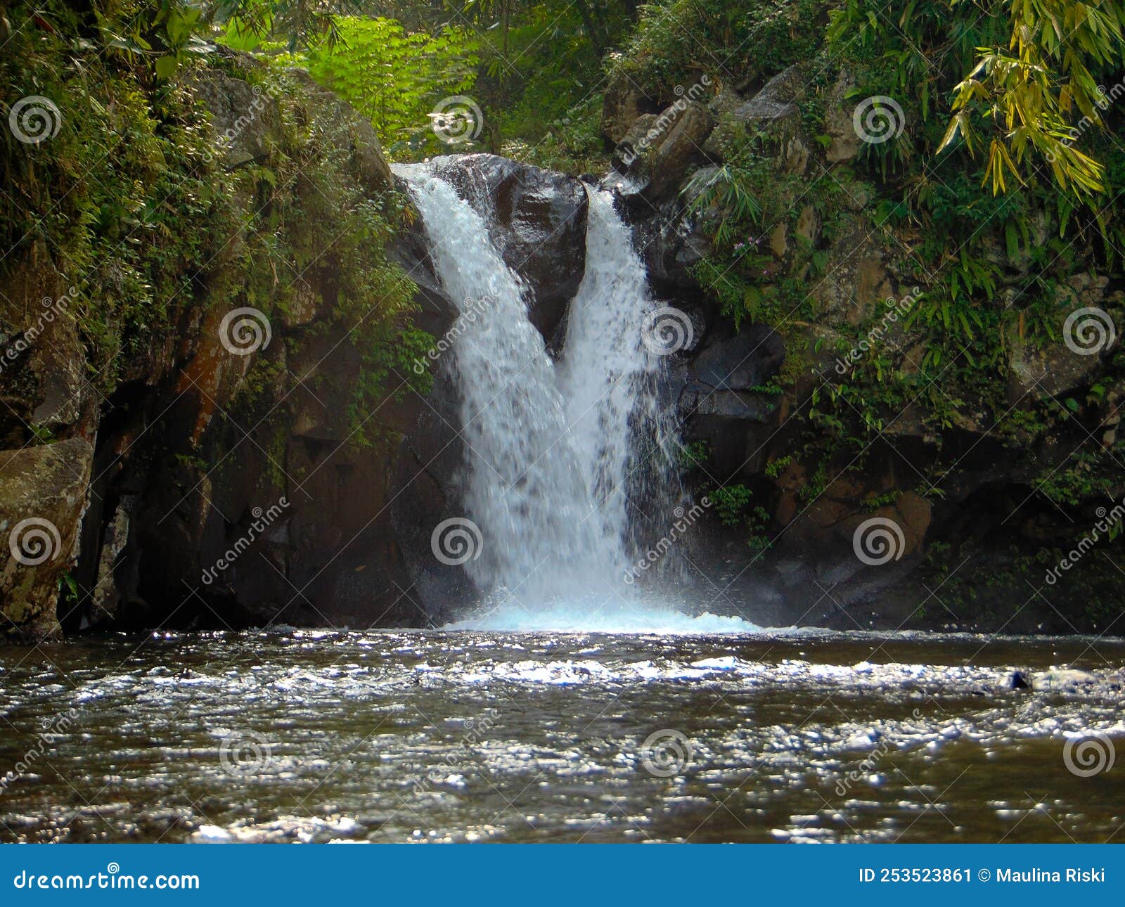 Water Falling into the River with at Waterfall in Indonesia Stock Image ...
