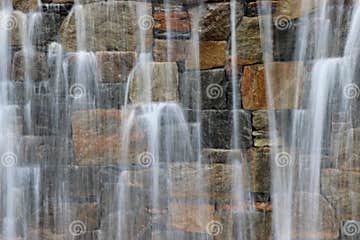 Water falling on rock wall stock photo. Image of black - 252201580