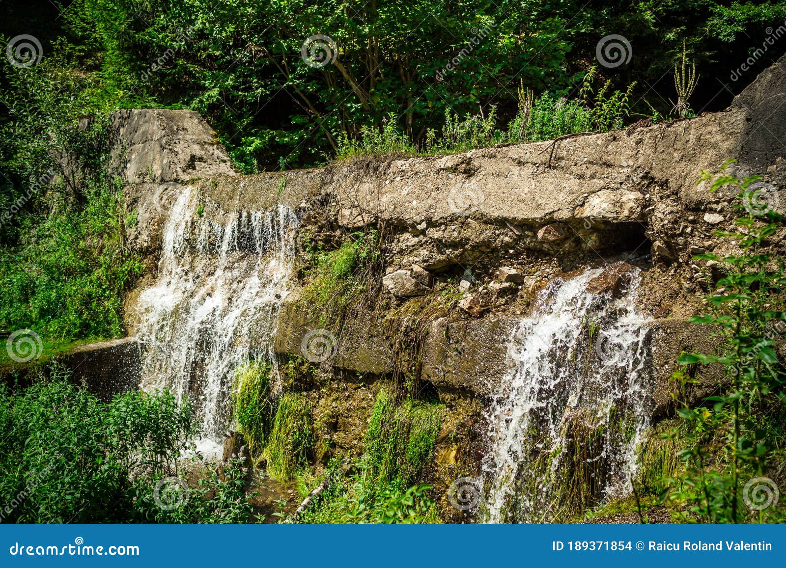 Water falling on rocks stock photo. Image of mountain - 189371854