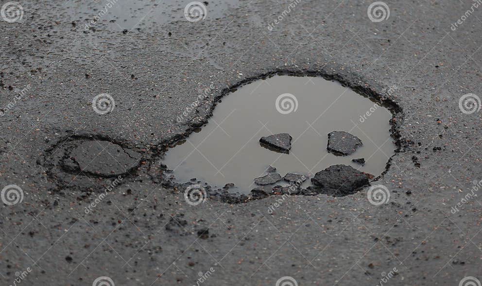 Water-filled Pothole in the Road Surface Stock Image - Image of pothole ...