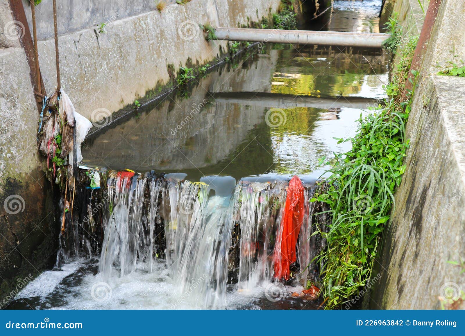 Water flow in the gutter stock photo. Image of waterway - 226963842