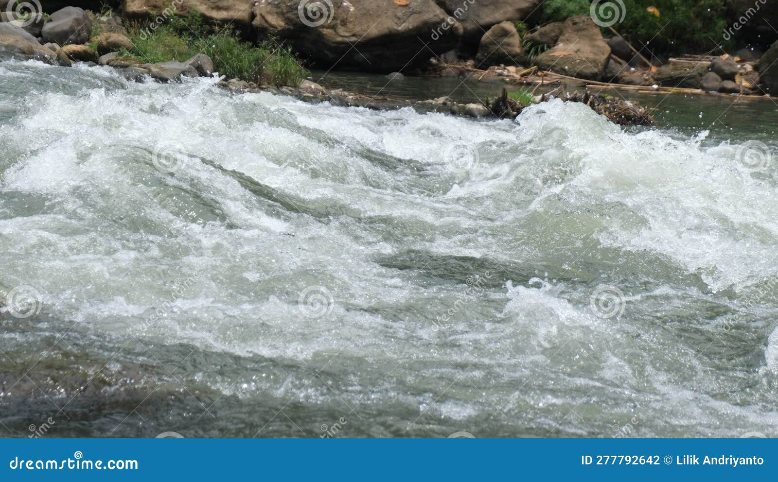 The Water Flow in the River is Clear with a Blend of Small Waves Stock ...
